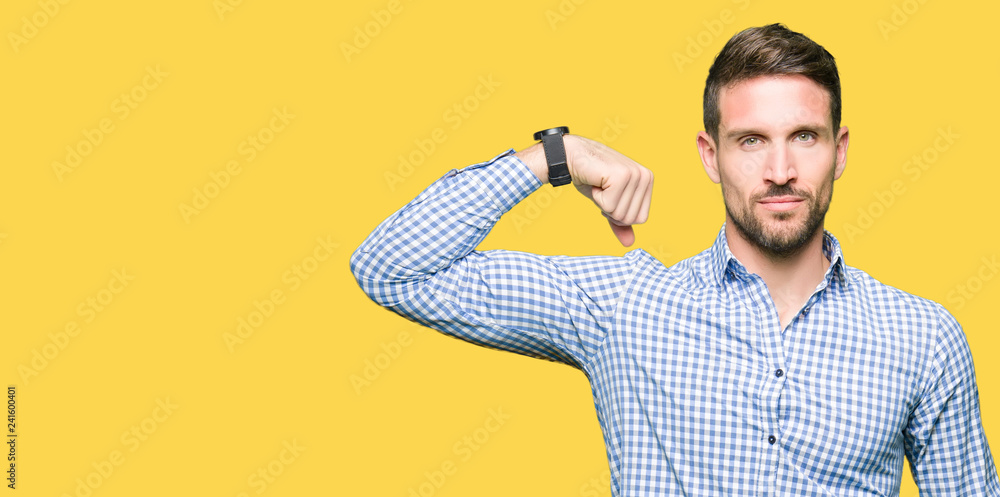 Handsome business man with blue eyes Strong person showing arm muscle ...