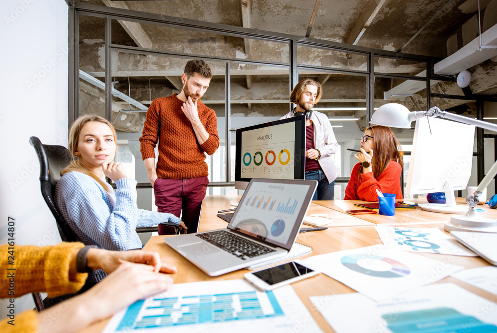 Group of young coworkers dressed casually working together on the ...