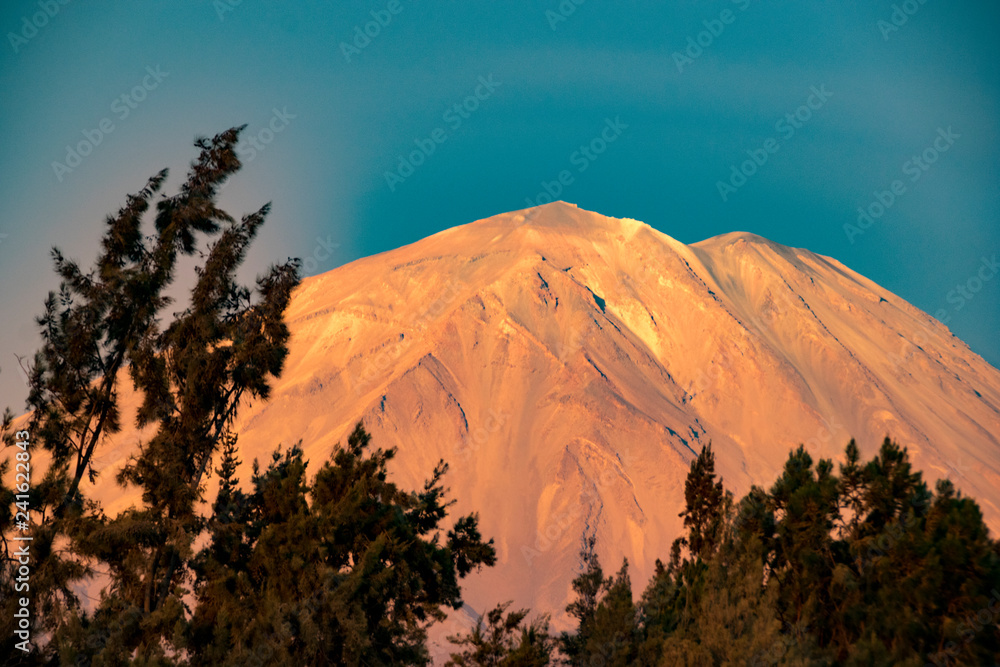 Misti and Pichu Pichu volcano seen from Arequipa Peru in a sunset. Some ...