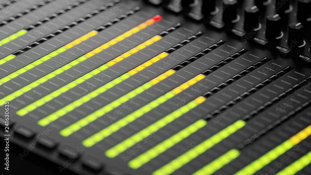 Colorful led lights indicating sound volume levels on a studio mixer ...
