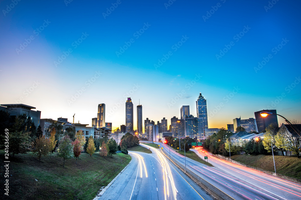 Beautiful big city view during blue hour with light trail from vehicle ...