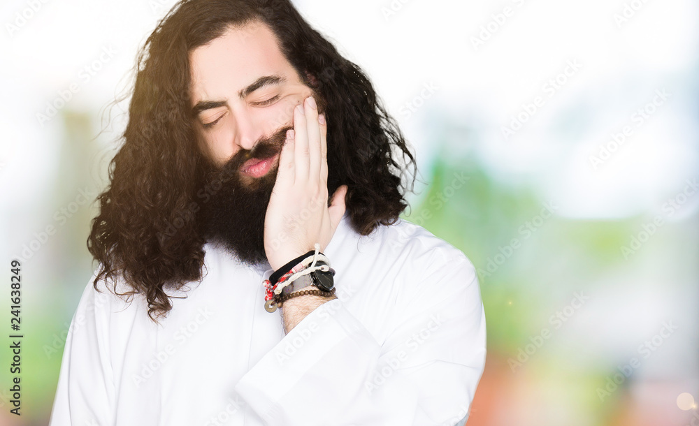 Man wearing Jesus Christ costume touching mouth with hand with painful ...