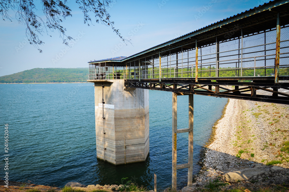 Water level meter Landscape with dam lake mountain reservoir with tower ...