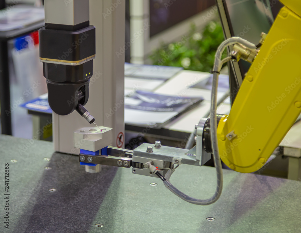 Robot arm loading workpiece to CMM Coordinate Measuring Machine ...
