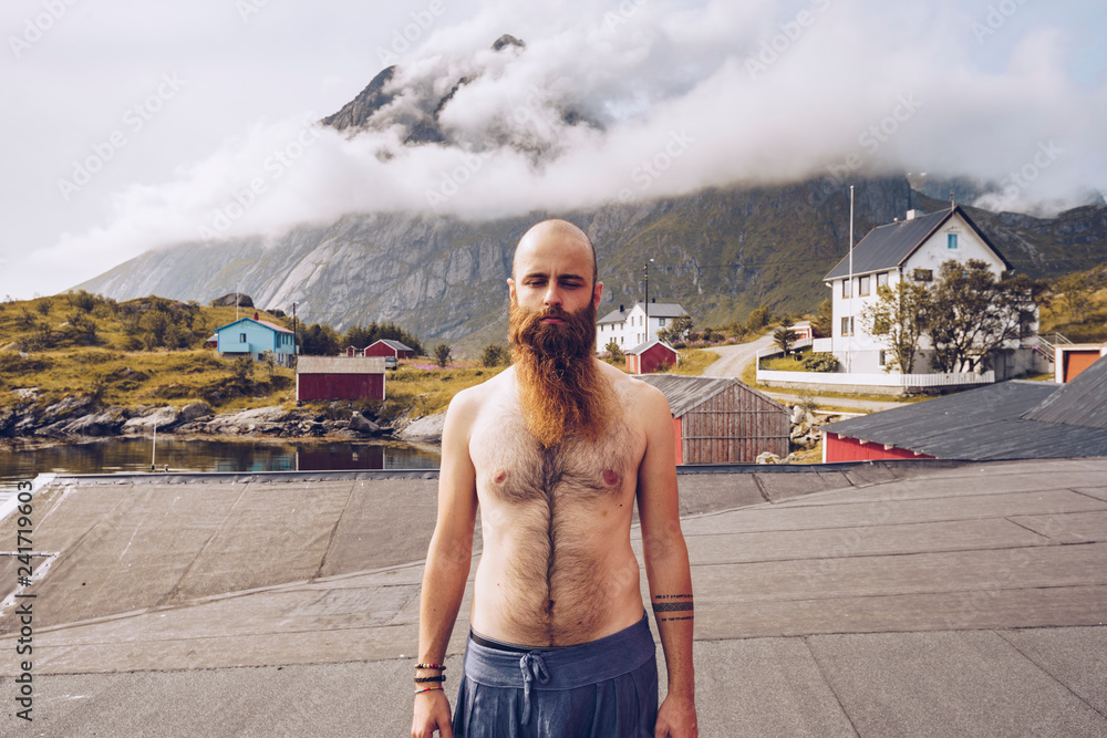 Norway, Lofoten, portrait of shirtless man with full beard Stock Photo ...