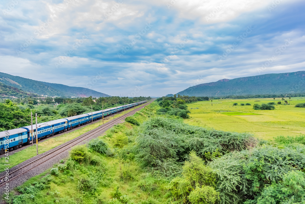 awesome view of indian railway running on track goes to horizon in ...