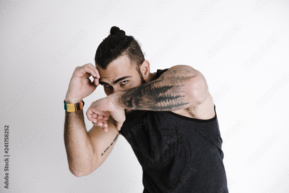 Man in defense stance against white background Stock Photo | Adobe Stock