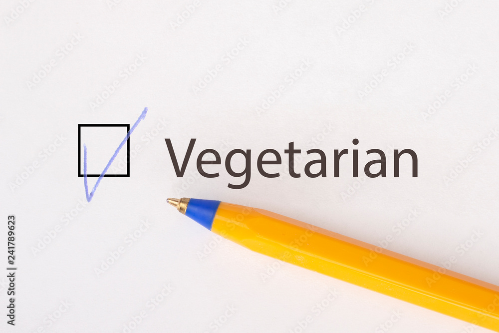 Vegetarian - checkbox with a tick on white paper with yellow pen ...