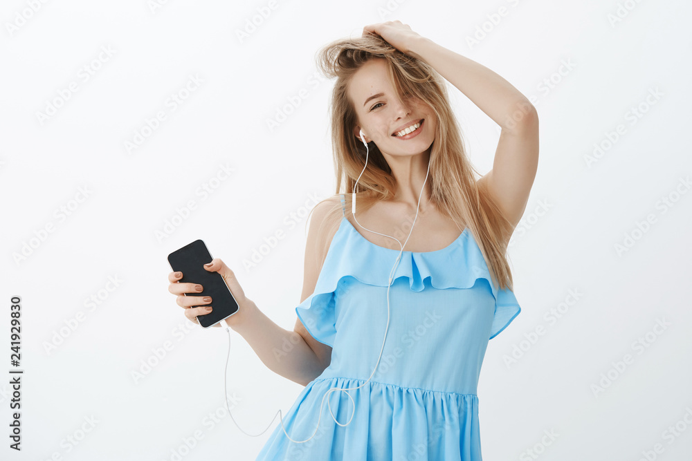 Gentle and attractive sincere friendly-looking woman with blond hair ...