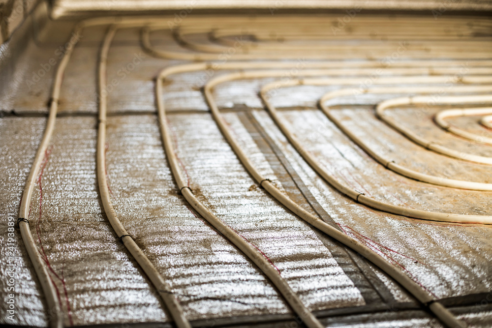 The process of installation of heat flooring in a new building house ...