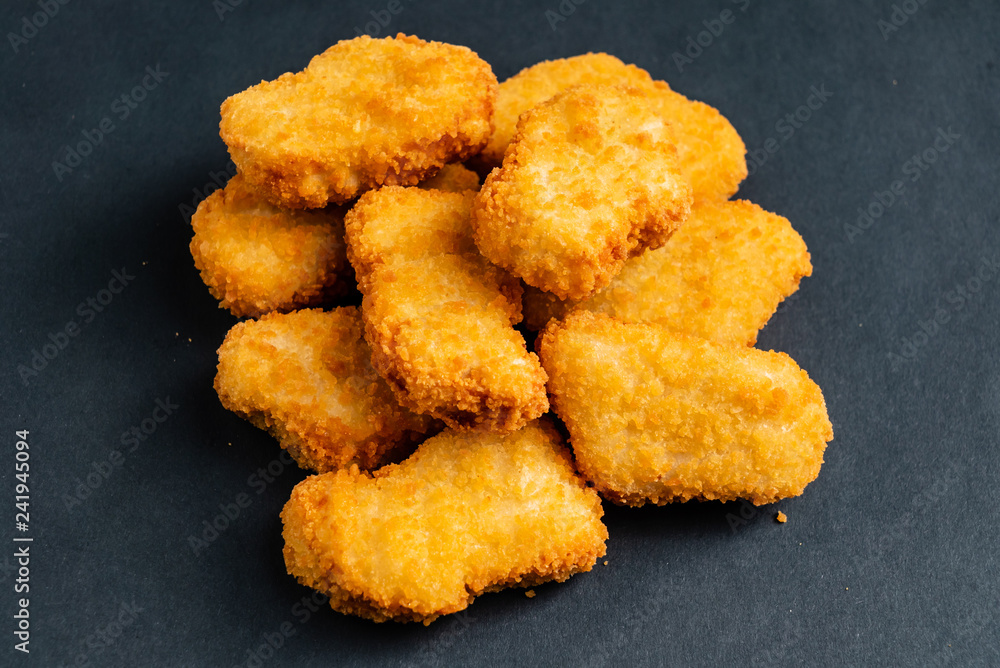 chicken nuggets on the black background Stock Photo | Adobe Stock