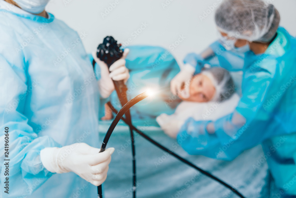 Endoscopy at the hospital. Doctor holding endoscope before gastroscopy ...