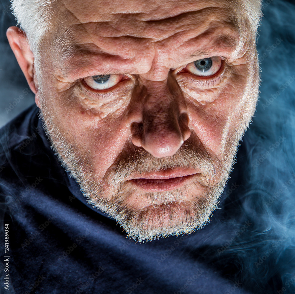 Portrait of a senior, stern looking man Stock-Foto | Adobe Stock