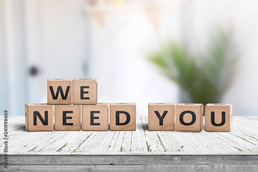 We need you sign on a white table in a bright room Stock Photo | Adobe ...