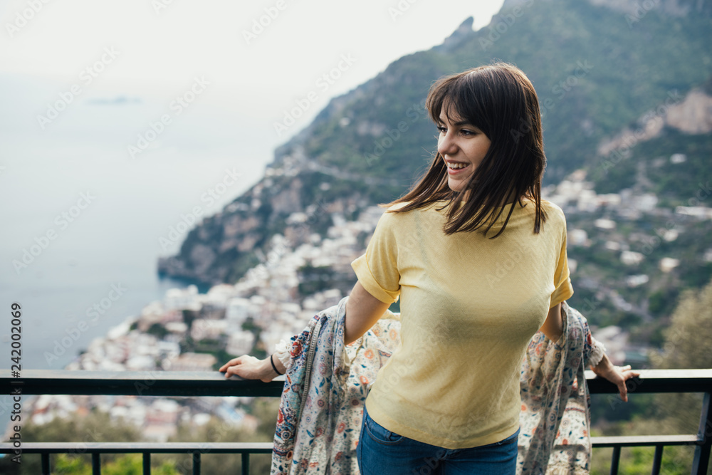 Italian young woman enjoying beautiful sunny weather in Positano on ...