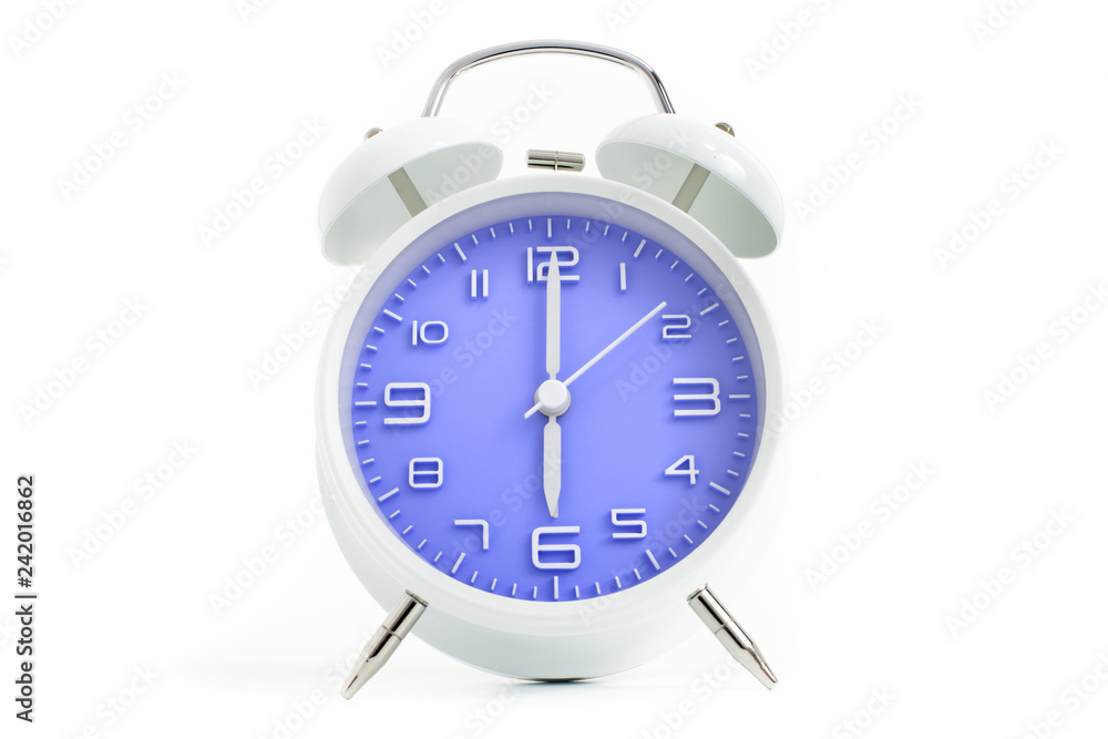 Twin bells analogue alarm clock with blue clock face shows six o’clock ...