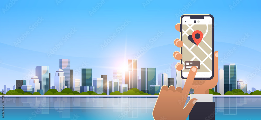 hand holding cell phone using online mobile map application gps ...