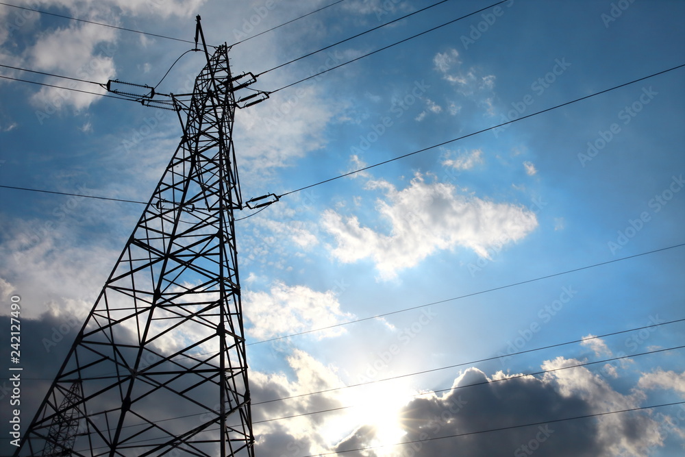 Stockfoto Overhead transmission of electricity through high voltage ...