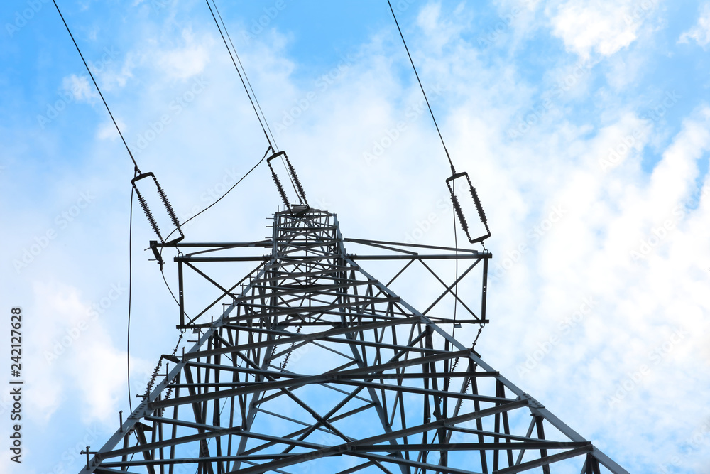 Fotka „Overhead transmission of electricity through high voltage lines ...