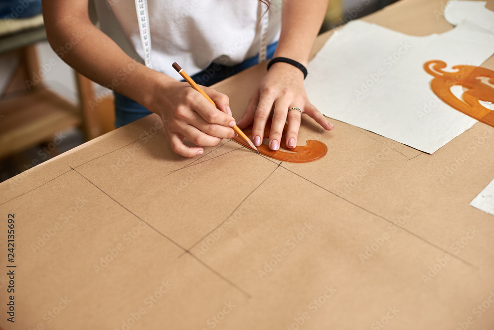 Workplace in design studio. Female designer hands close-up making ...
