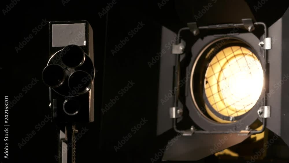 Vidéo Stock Vintage 8mm film movie camera rotating on black background ...