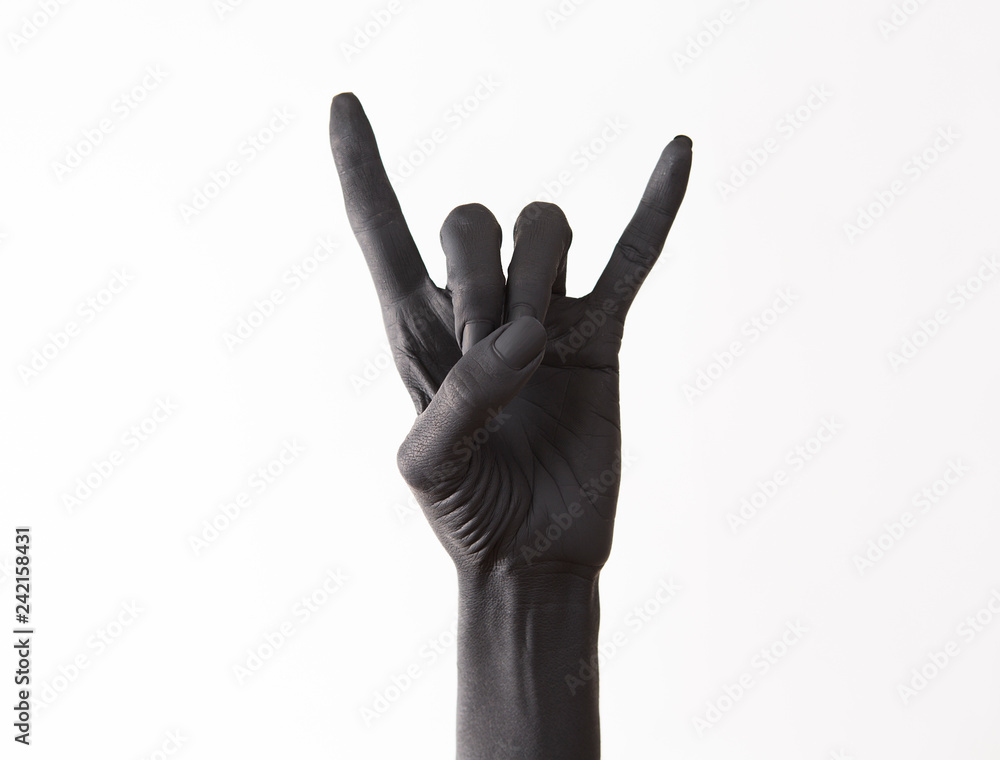 Goat gesture on a dark background. Black hand doing rock symbol. Hands ...