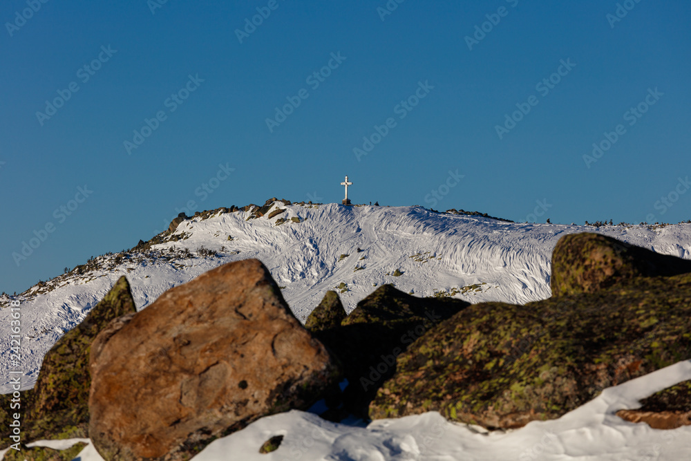 beautiful mountain valley in winter. in the foreground there are large ...
