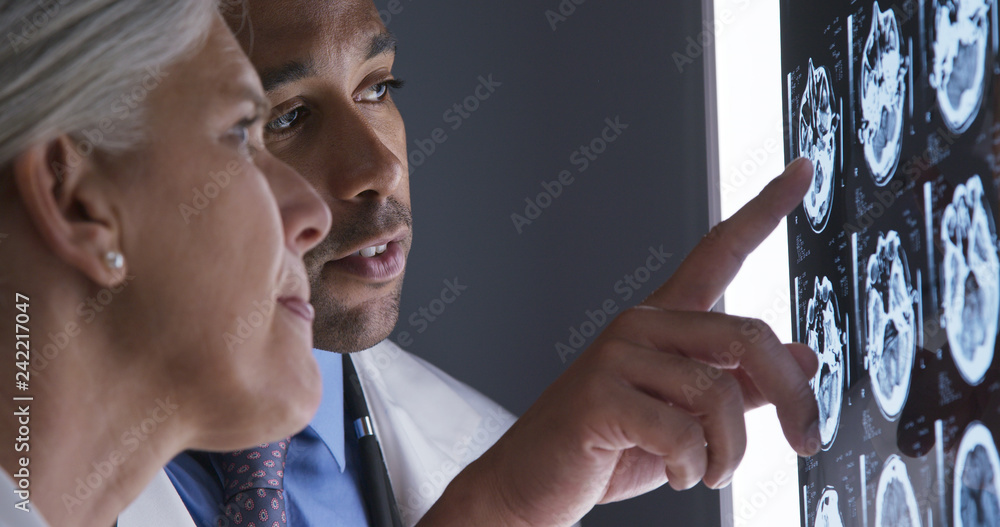Tight shot of millennial african-american doctor discussing with senior ...