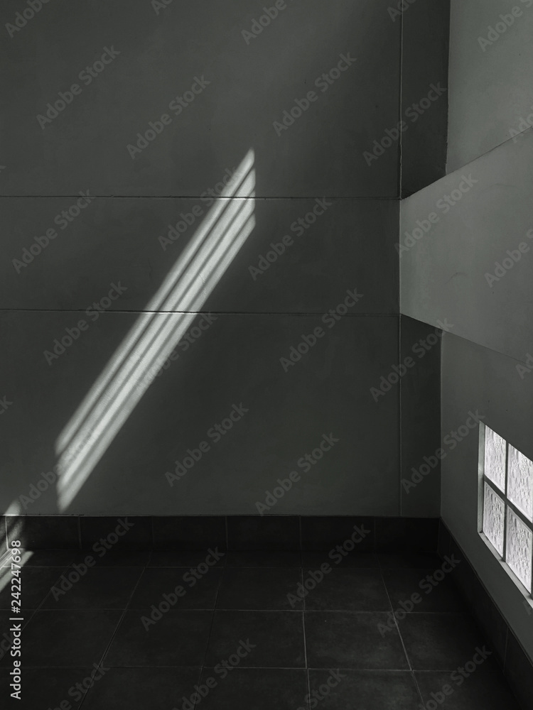 dark room in the building with ray of light placing on the wall, dark ...