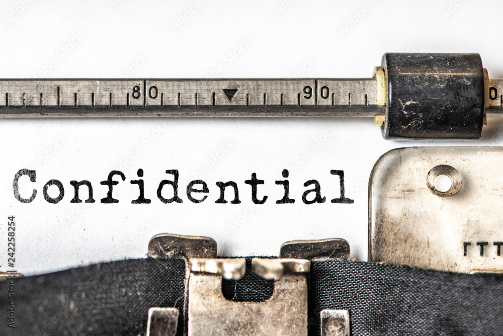 Confidential typed words on a vintage typewriter. Close up Stock Photo ...