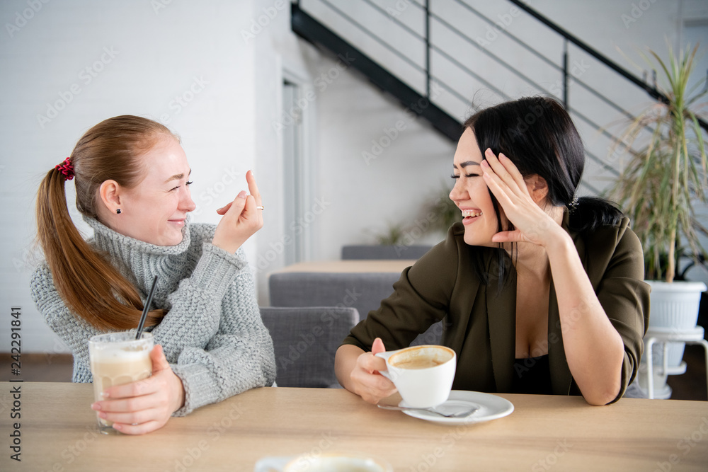 women giving rude middle finger hand gesture to her best friend having ...