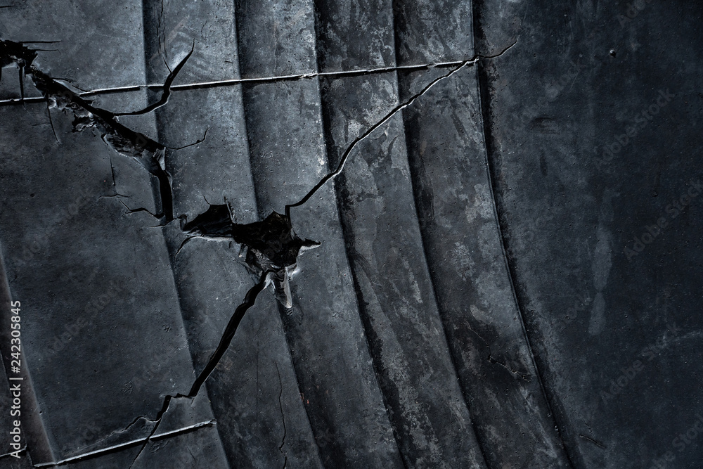 Old cracked rubber tire texture. Abstract damaged black surface ...