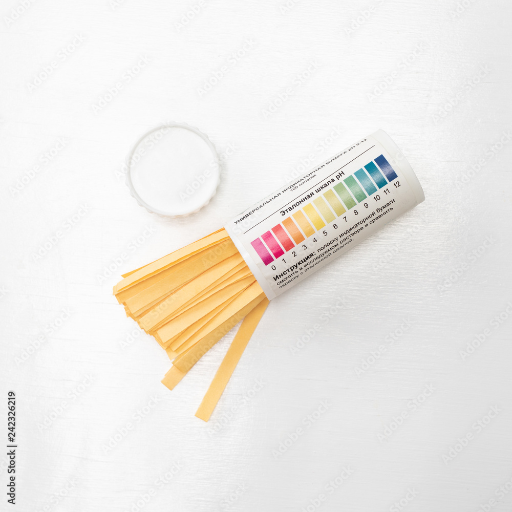 Pack of litmus test paper and color samples on white background ...