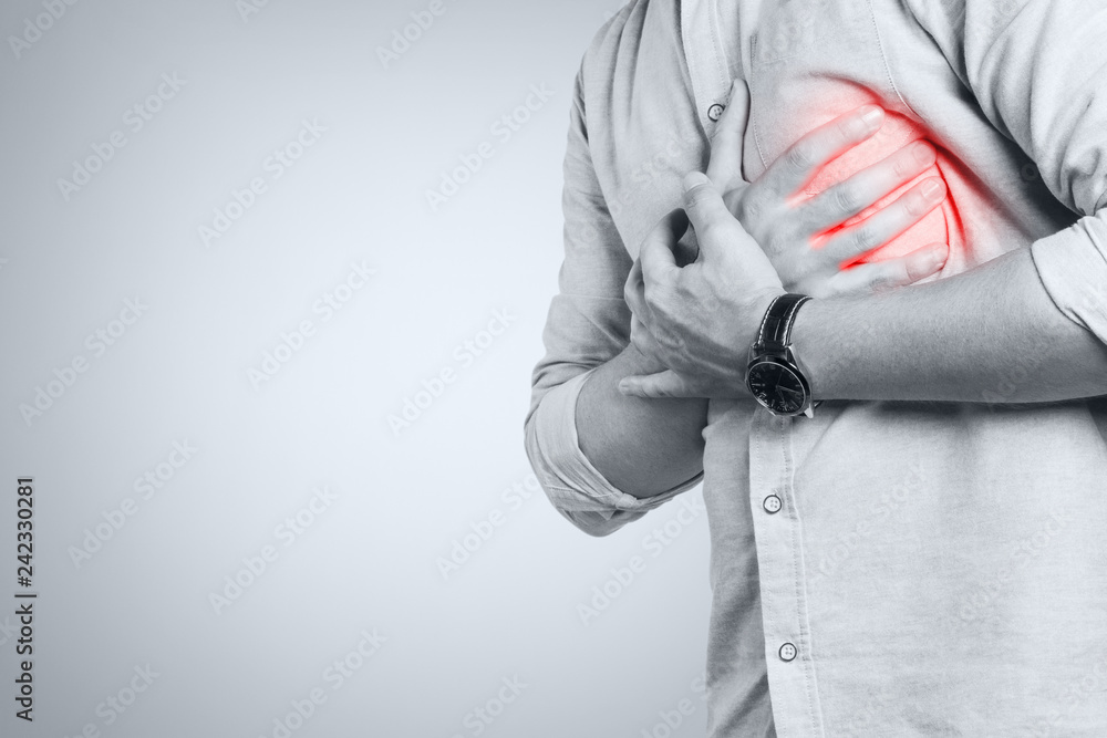 Man having a sudden heart attack Stock Photo | Adobe Stock