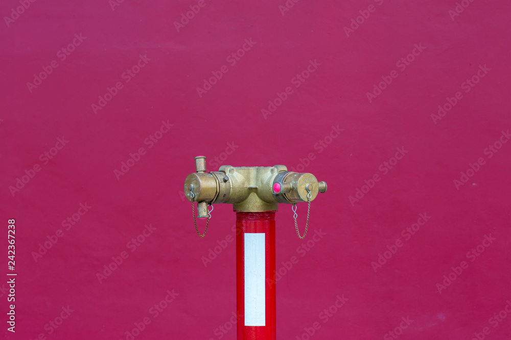 Red fire pump in front of concrete wall. fire safety pump on cement ...