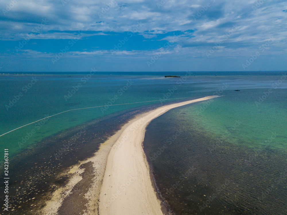 Aerial view of curved beach of Pontod virgin island located near ...