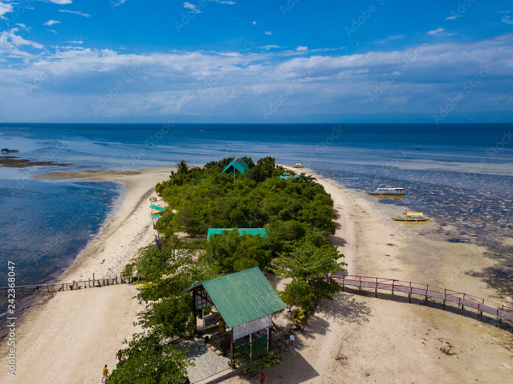 Aerial view of curved beach of Pontod virgin island located near ...
