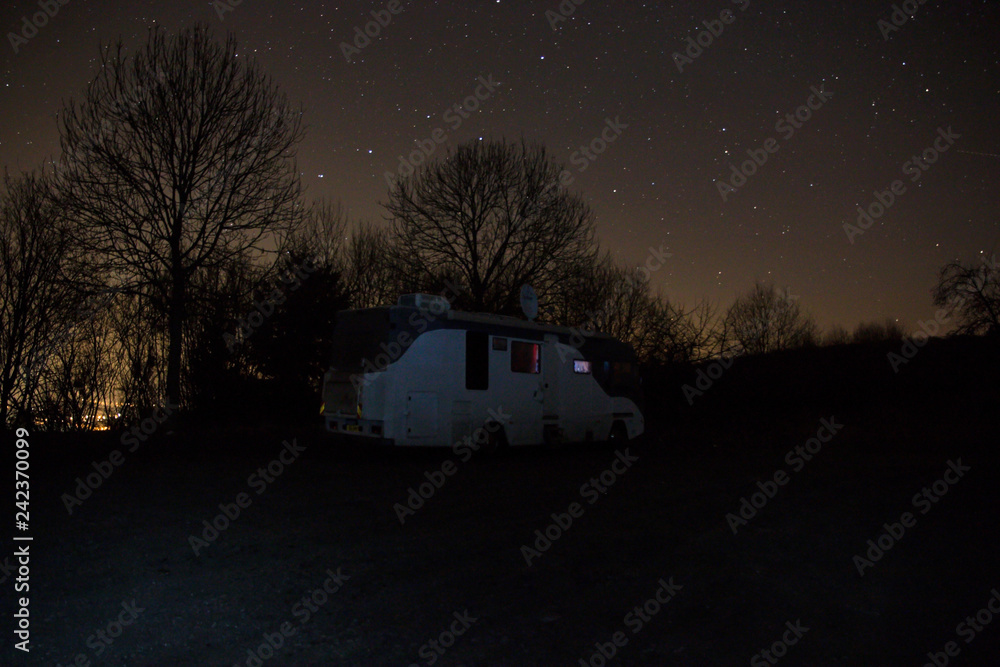 Camper van on a starry night Stock Photo | Adobe Stock