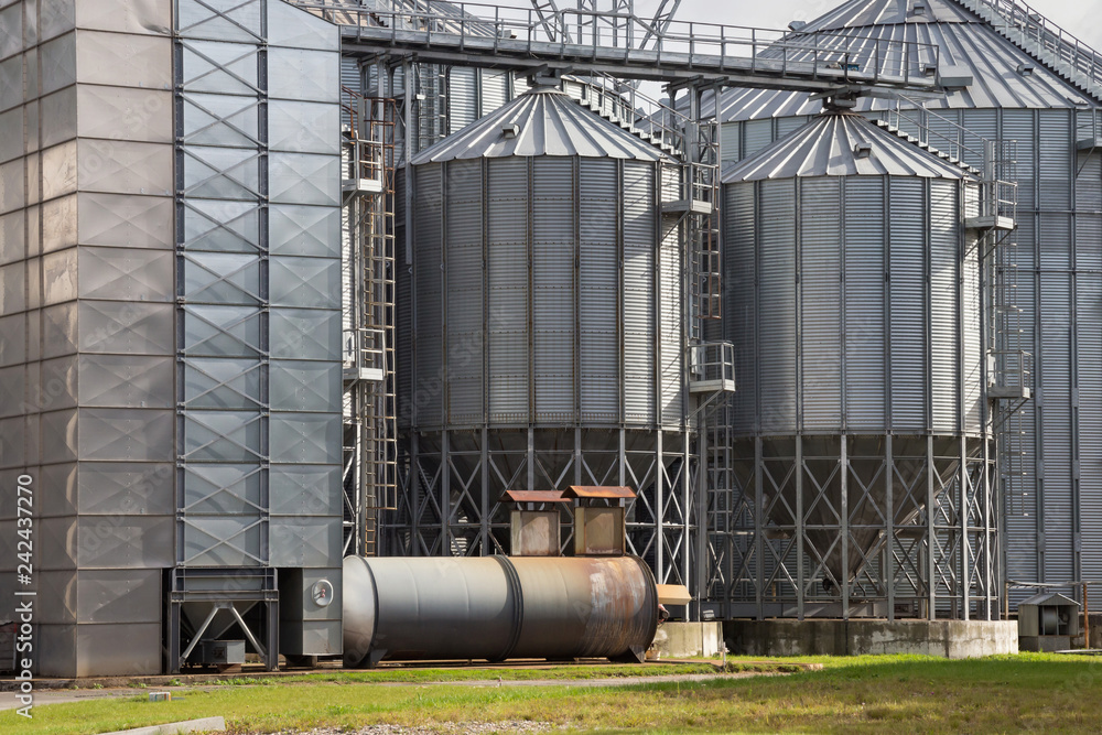 Exterior of Agricultural Silo building with storage tanks for ...