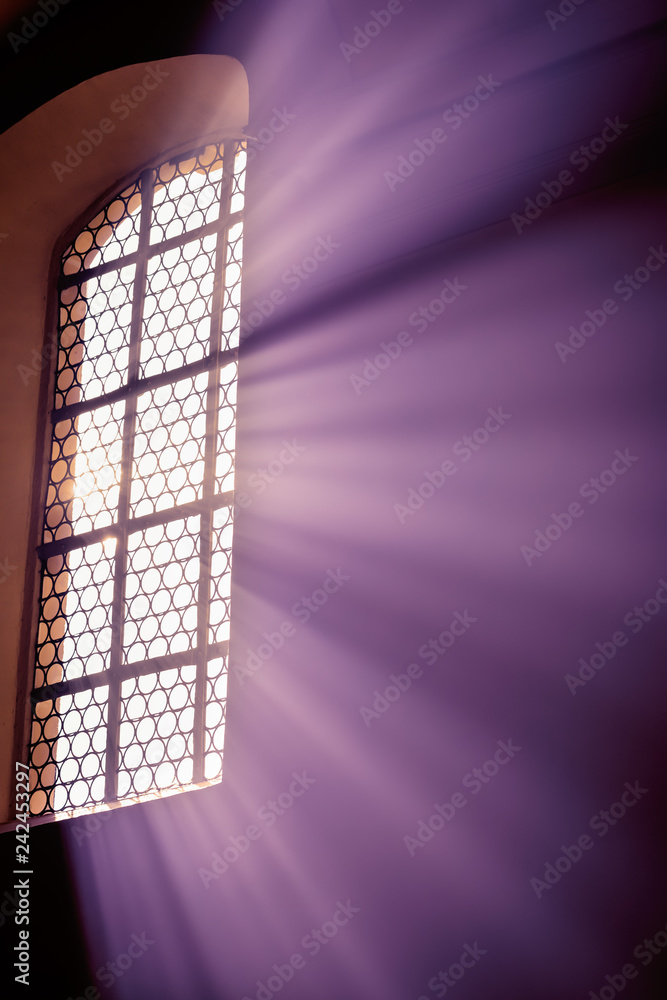 Purple light rays through the black window Stock Photo | Adobe Stock