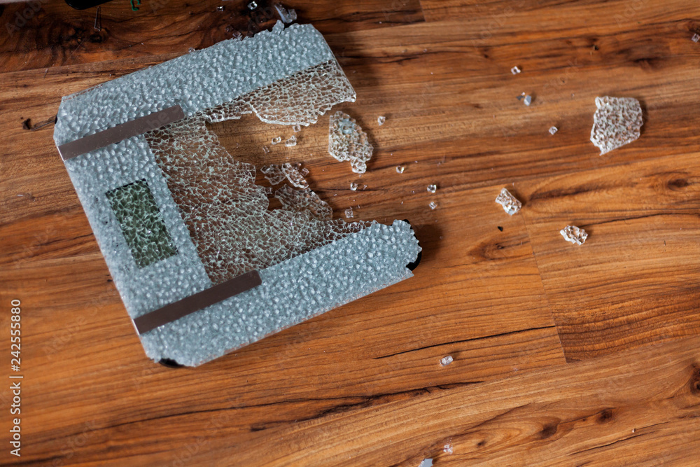 Broken digital human scale on the floor. Broken glassy digital scale ...