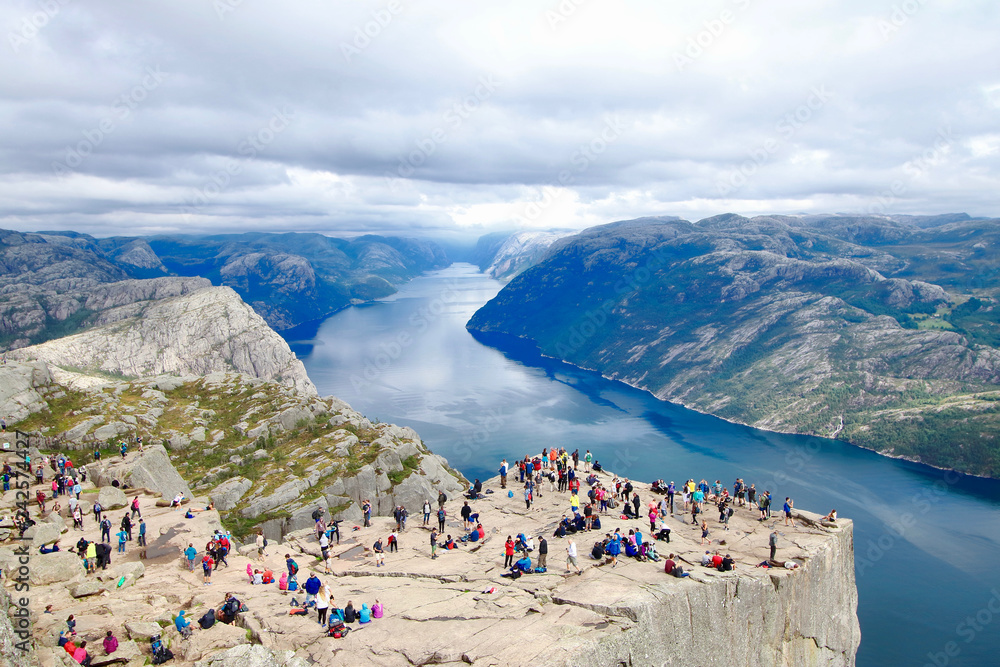 Several hikers enjoying the views in the summit of the Pulpit Rock ...