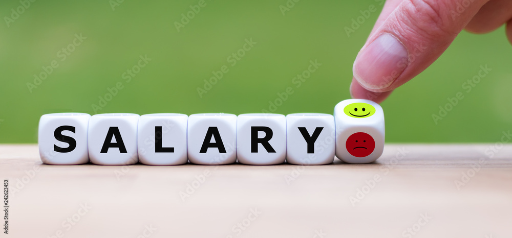 Hand is turning a dice and changes a angry emoji to a happy emoji ...