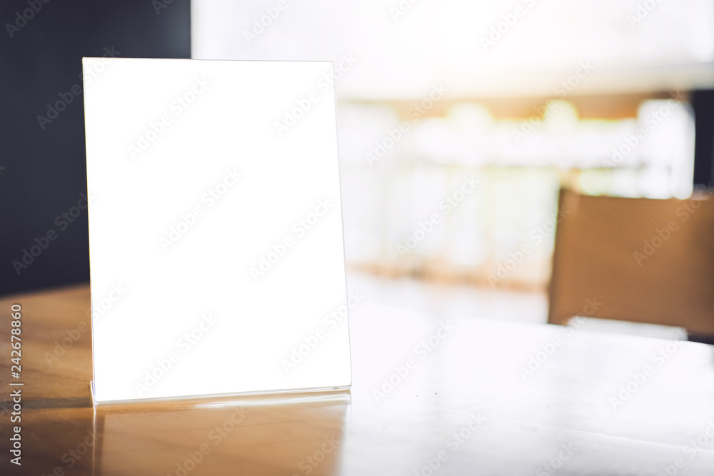 Mock up blank menu frame on table in coffee shop stand for your text of ...