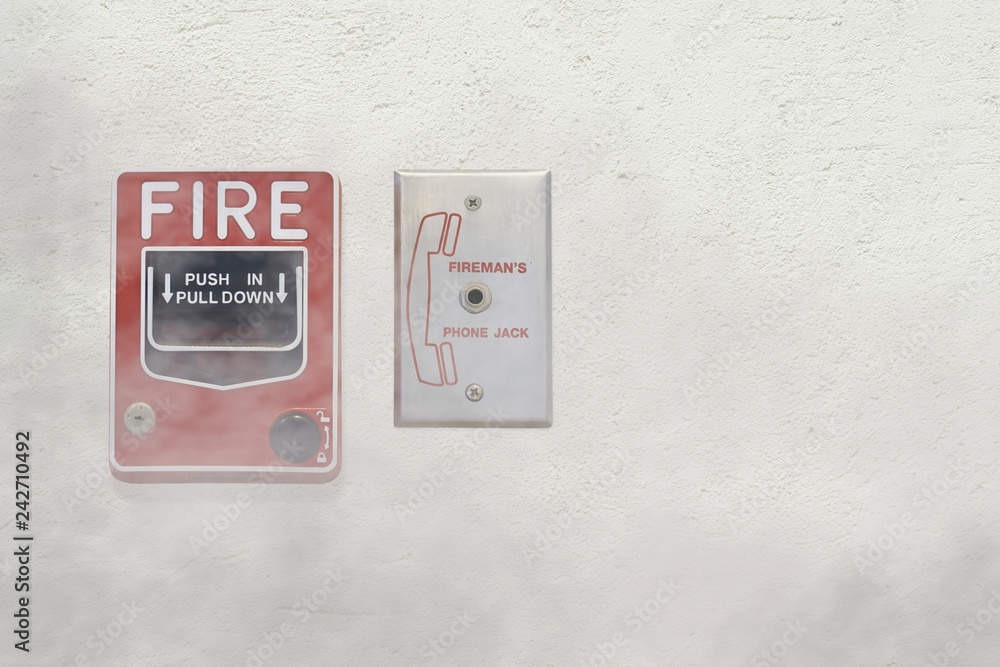 Fire Alarm Notifier and Fireman's Phone Jack on Cement Plaster Wall ...