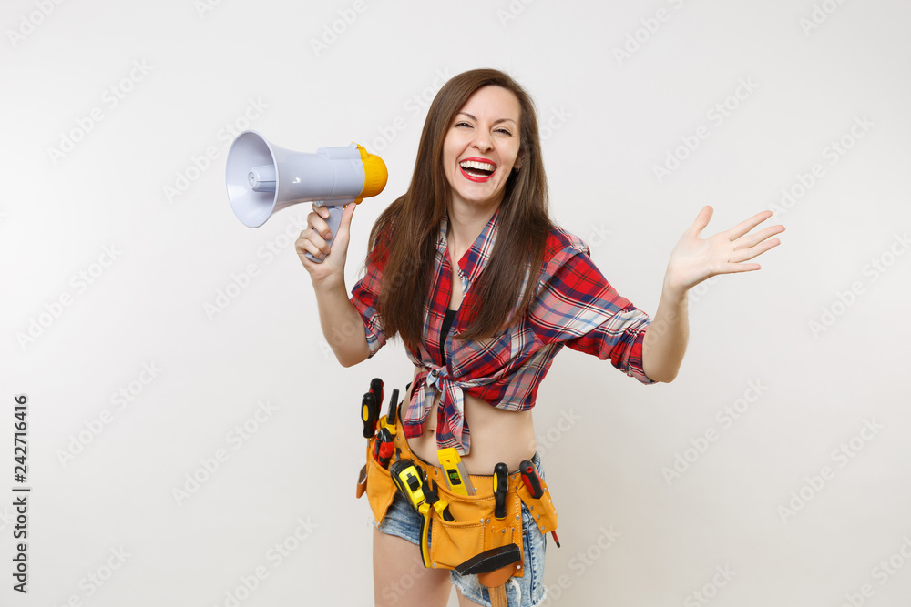 Young excited handyman woman in plaid shirt, denim shorts, kit tools ...