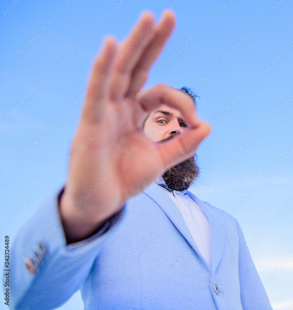 I am watching you. Guy looks through ok gesture close up. Spying ...