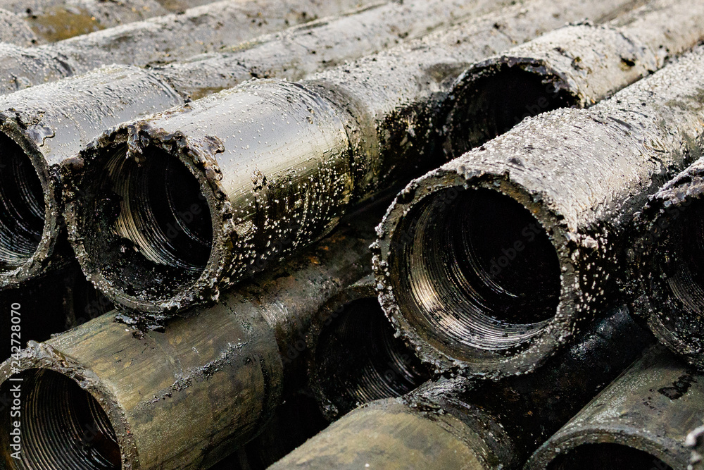 Oil Drill pipe. Rusty drill pipes were drilled in the well section ...