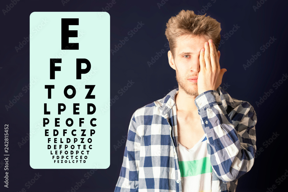 young male test eye vision and cover eye with hand b Stock Photo ...