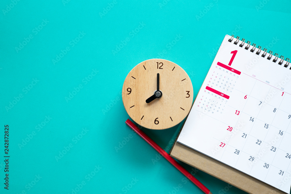 close up of calendar, clock and pencil on the table, planning for ...